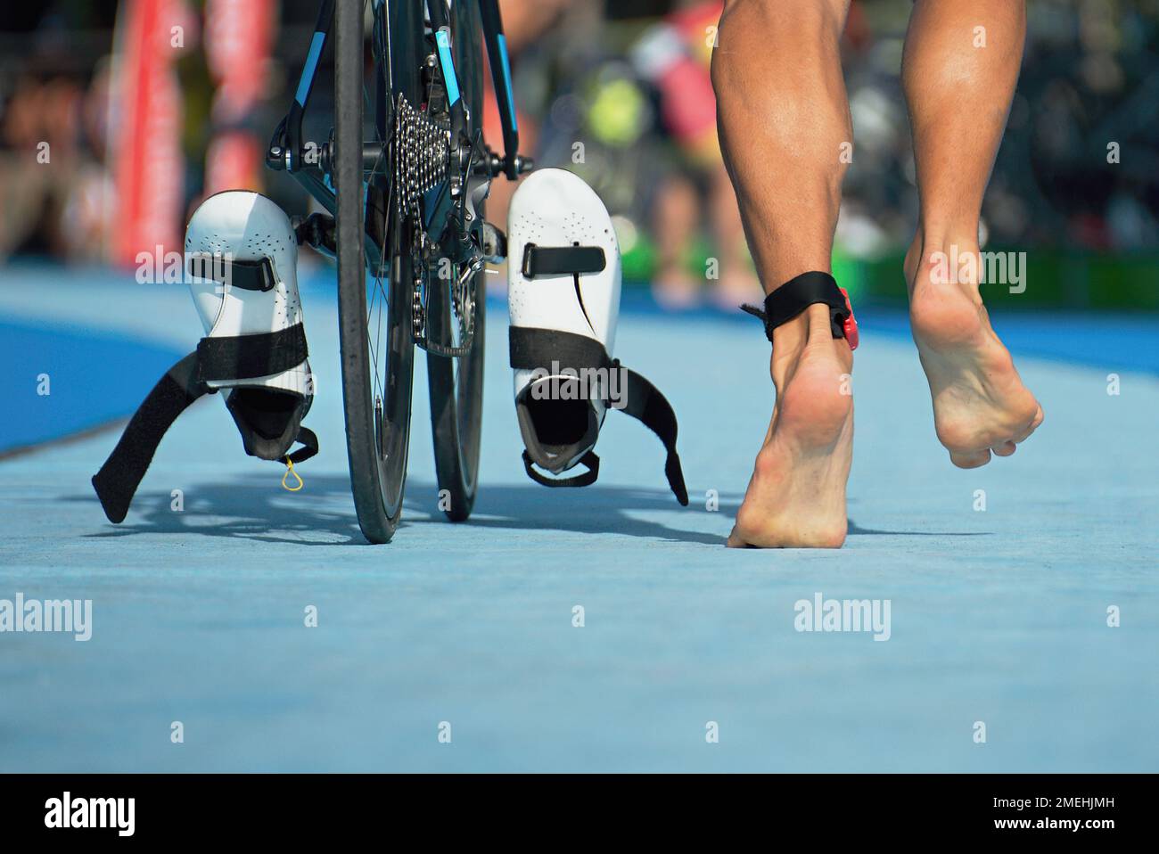 Triathlon bike the transition zone detail of the legs Stock Photo - Alamy