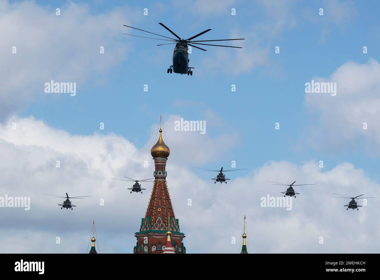 Russian Air Force's helicopters fly over St. Basil's Cathedral during a ...