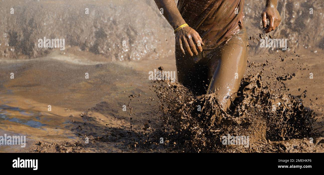 Running in mud hi-res stock photography and images - Alamy