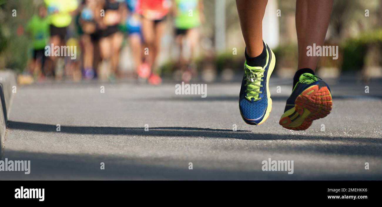 Marathon running in the light of evening Stock Photo - Alamy