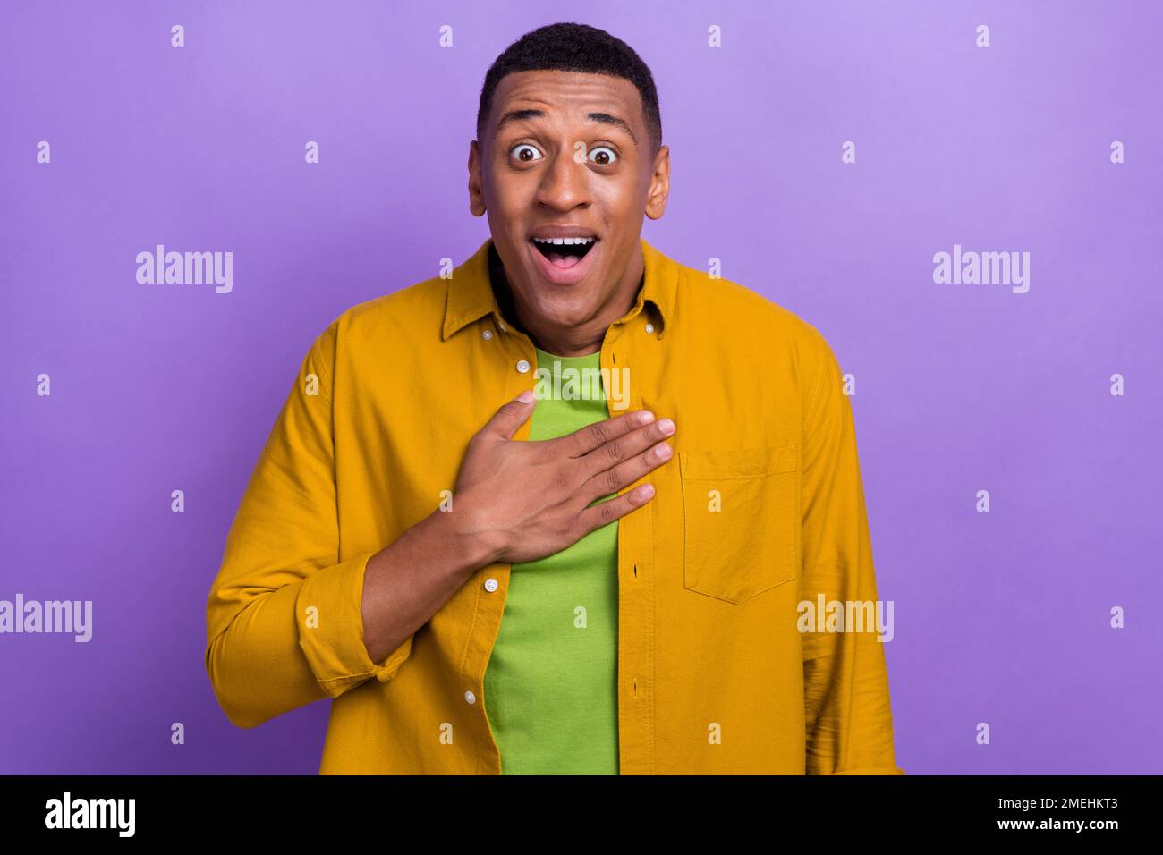 Photo portrait of nice young guy touch chest cant believe excited ...