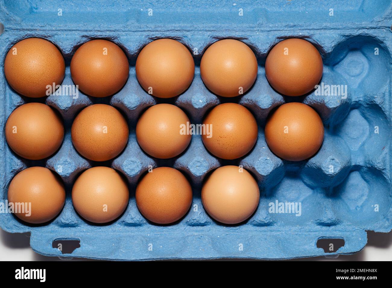 top view freerange fresh eggs in blue recycled carton crate. Farm ...