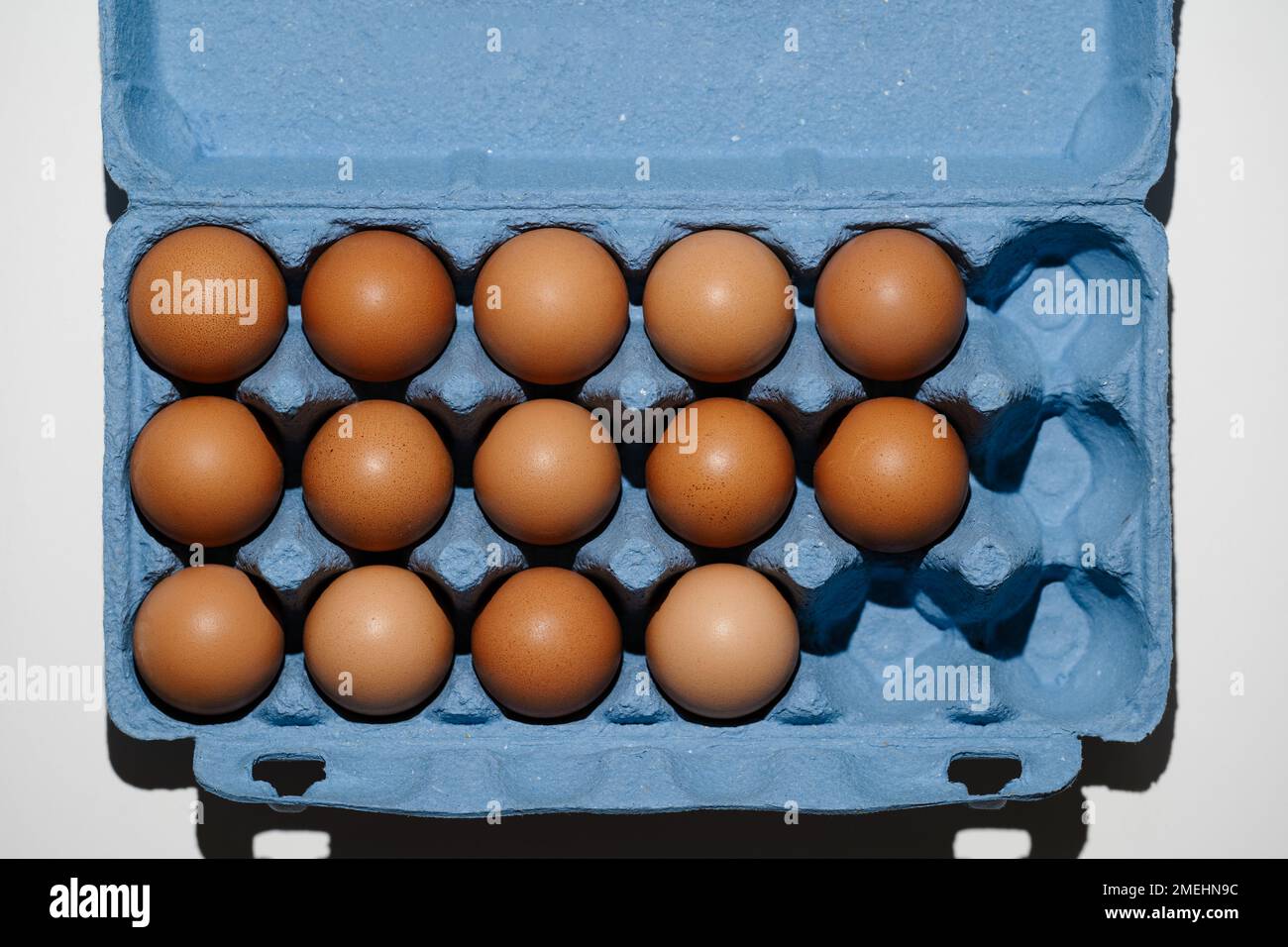 top view freerange fresh eggs in blue recycled carton crate. Farm ...