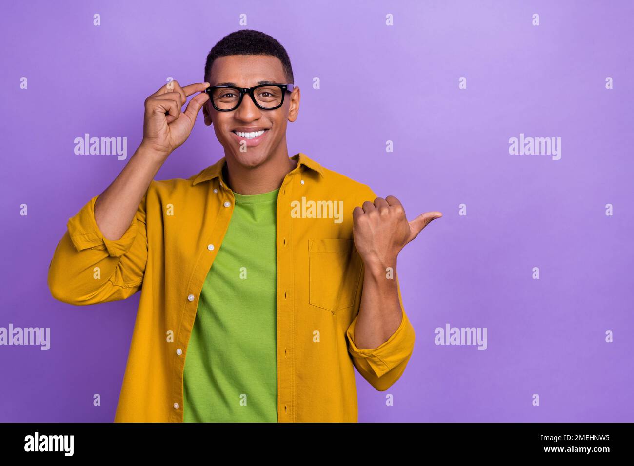 Photo portrait of nice young guy touch specs point empty space oculist ...