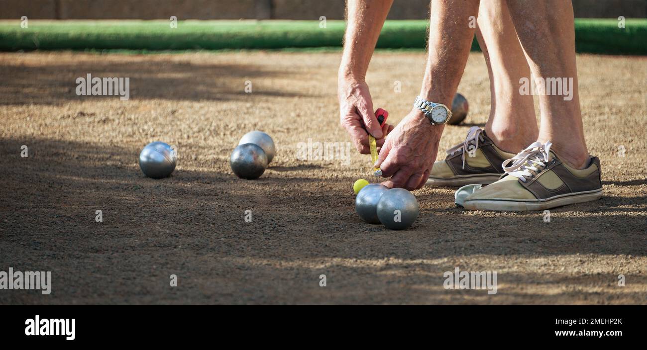 Petanque game, measuring the distance, deciding who's the winner Stock ...