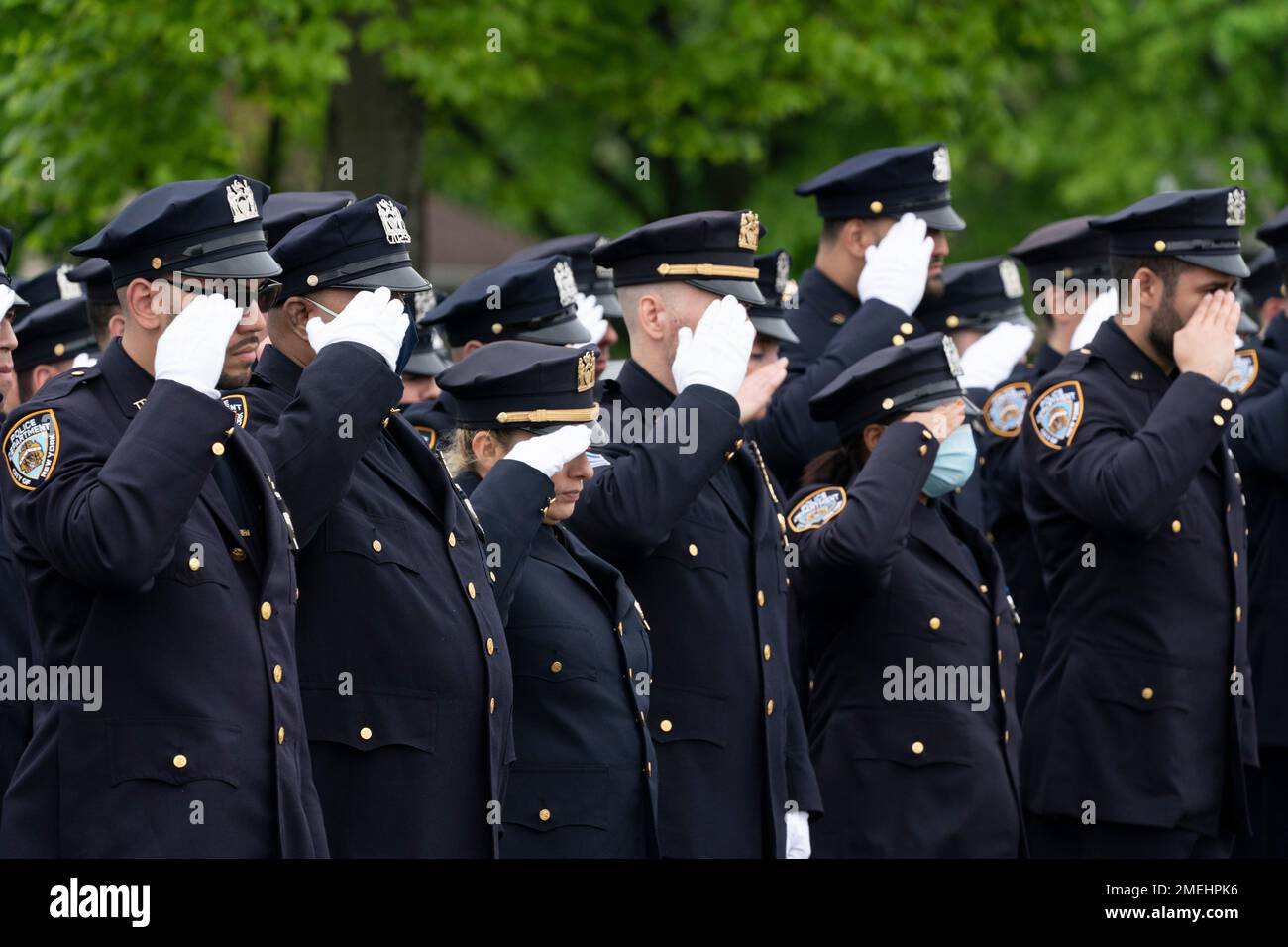 Police officers line the street as the funeral procession of New York ...