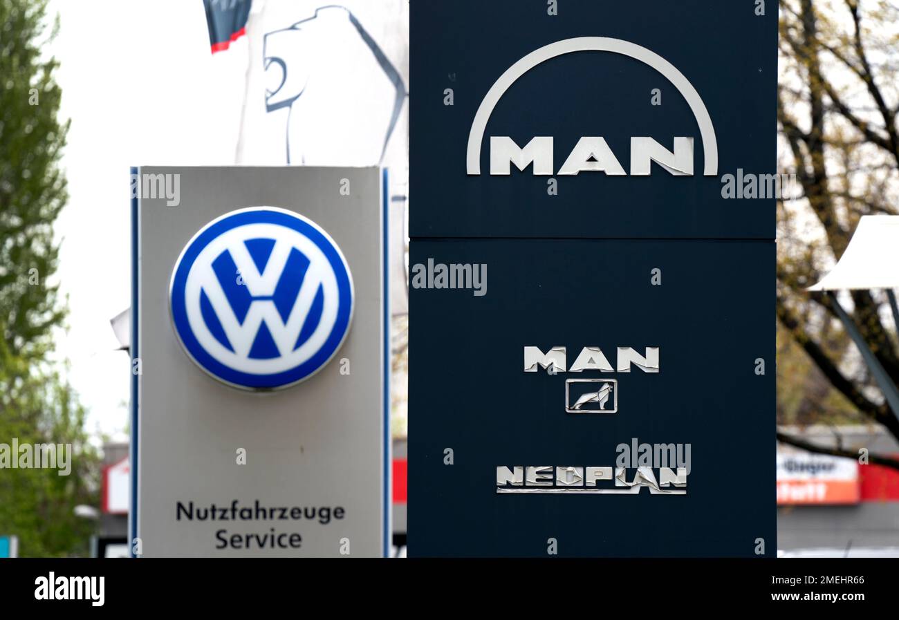 The logos of the truck manufactor MAN, right, and Volkswagen, left, are ...