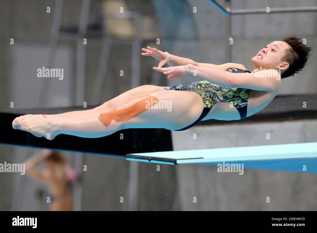 Chen Yiwe of China performs a dive during the women's 3-meter springboard final at the FINA ...