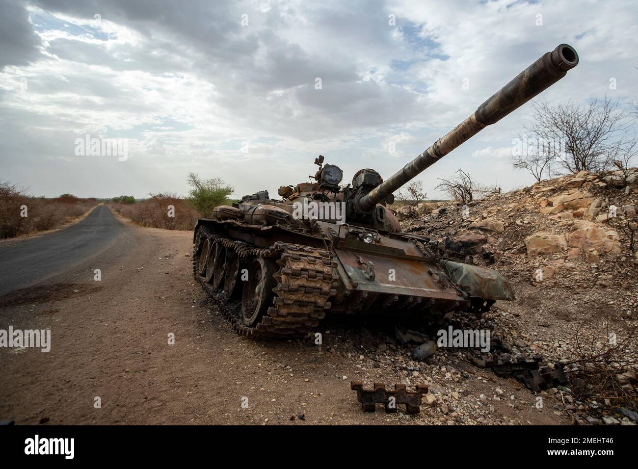 A destroyed tank is seen by the side of the road south of Humera, in an ...