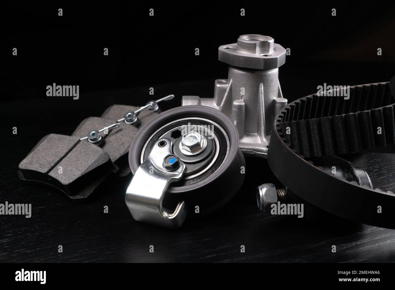 Auto parts spare parts car on black background. Large number rotate on ...