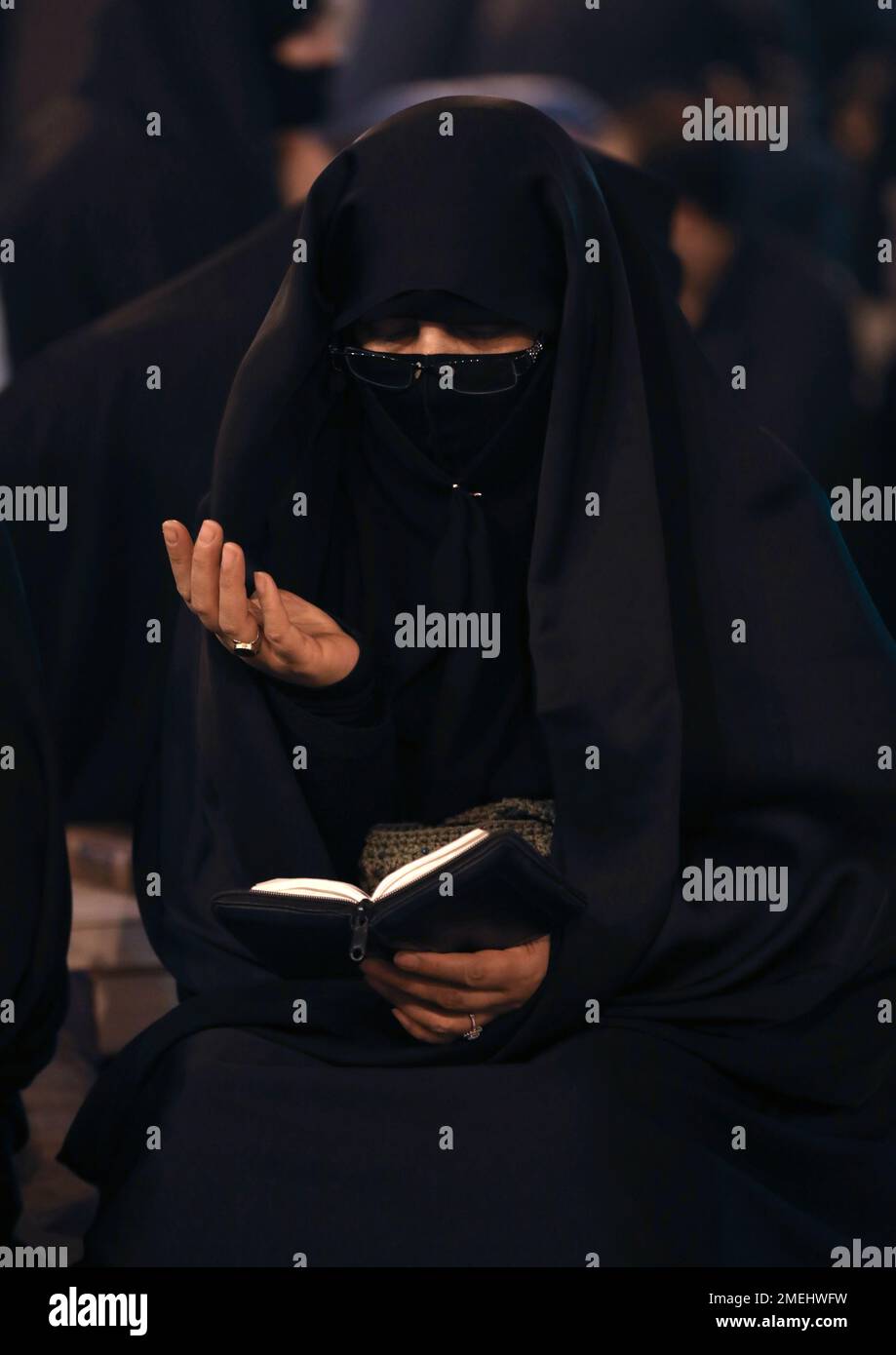A worshipper prays at the Laylat al-Qadr, or the night of destiny, in ...