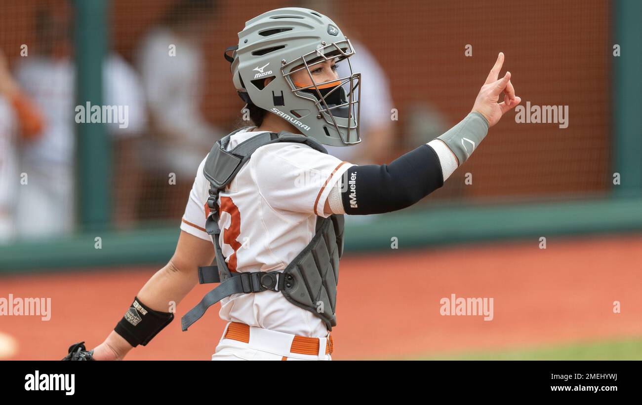 Texas catcher Mary Iakopo calls out to her team as they compete against ...