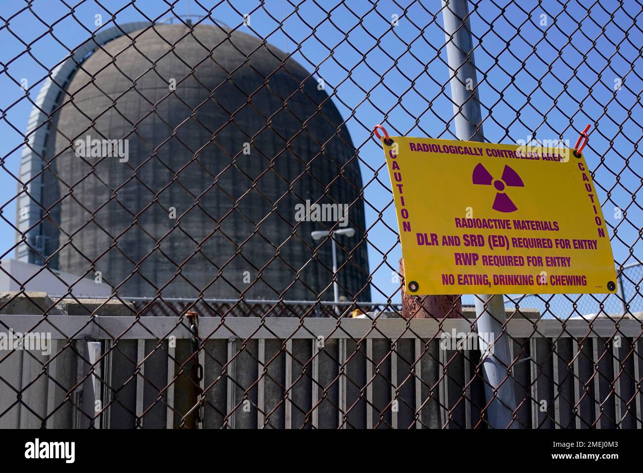 A sign warning of radioactive materials is seen on a fence around a ...