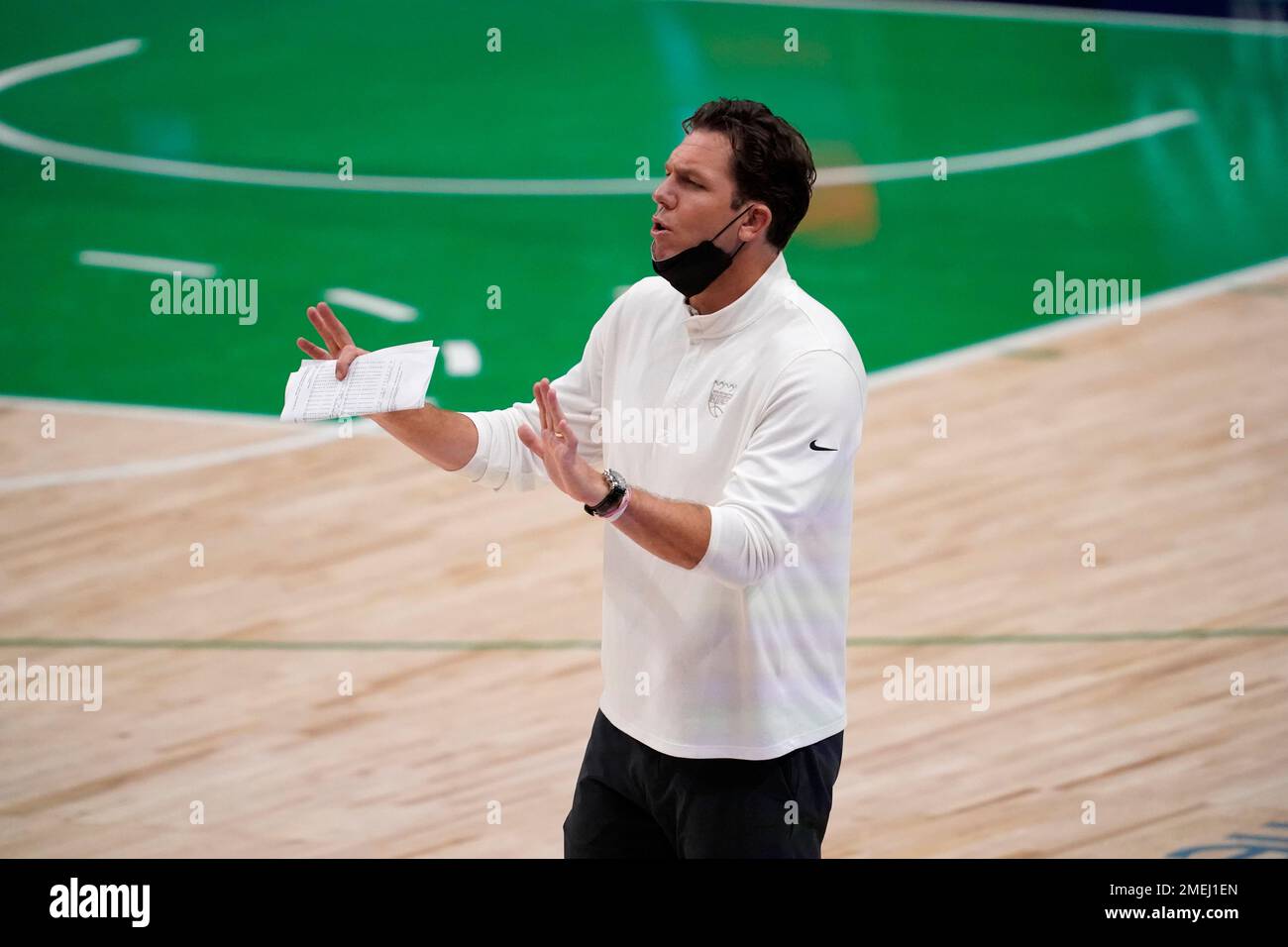 Sacramento Kings head coach Luke Walton talks to officials during an ...
