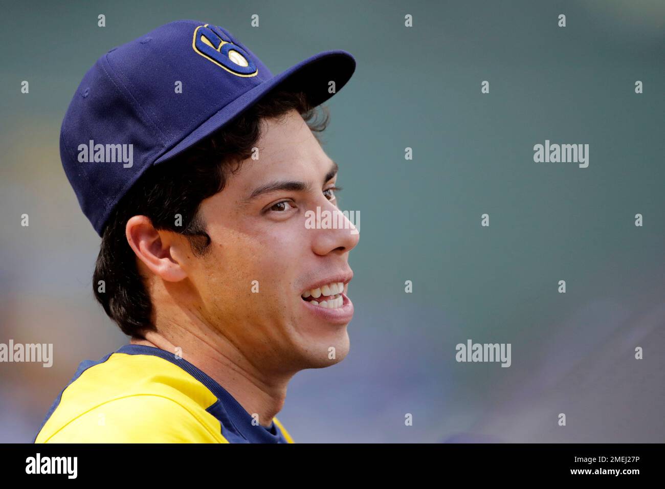 Milwaukee Brewers' Christian Yelich smiles in the dugout during the ...