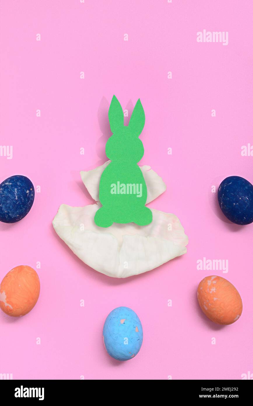 Easter Bunny in a cabbage leaf. Laying out the painted eggs. Concept ...