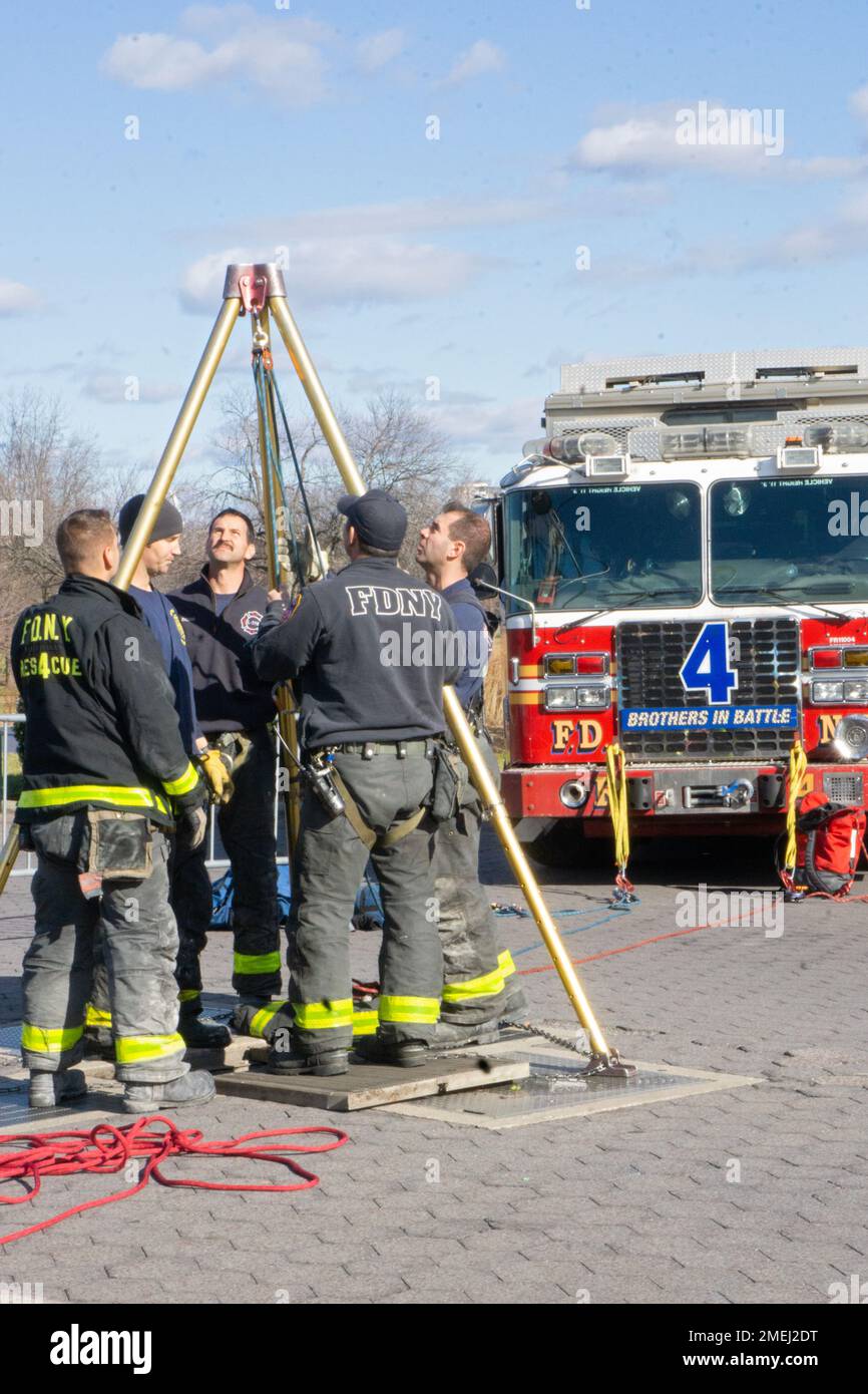 Firemen from various stations train to rescue a person stuck in a hole ...
