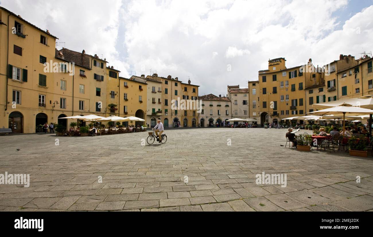The famous round square Piazza dell Anfiteatro in the city of Lucca ...