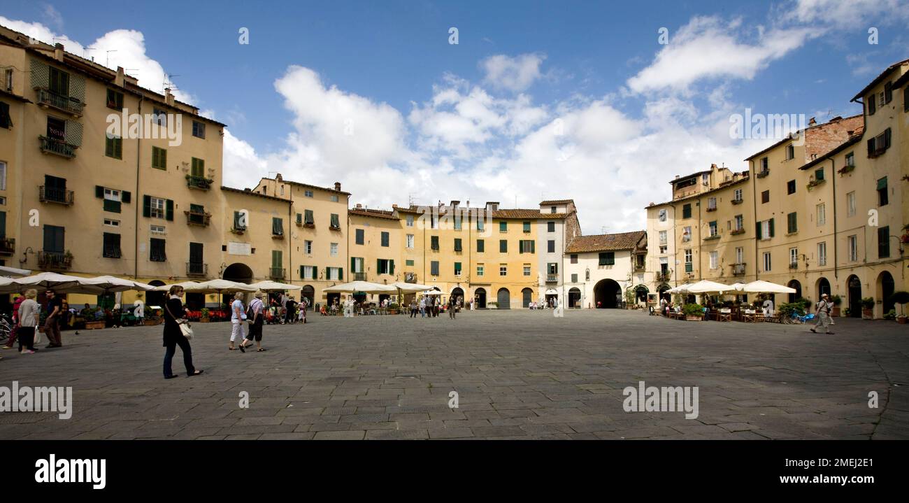 The famous round square Piazza dell Anfiteatro in the city of Lucca ...
