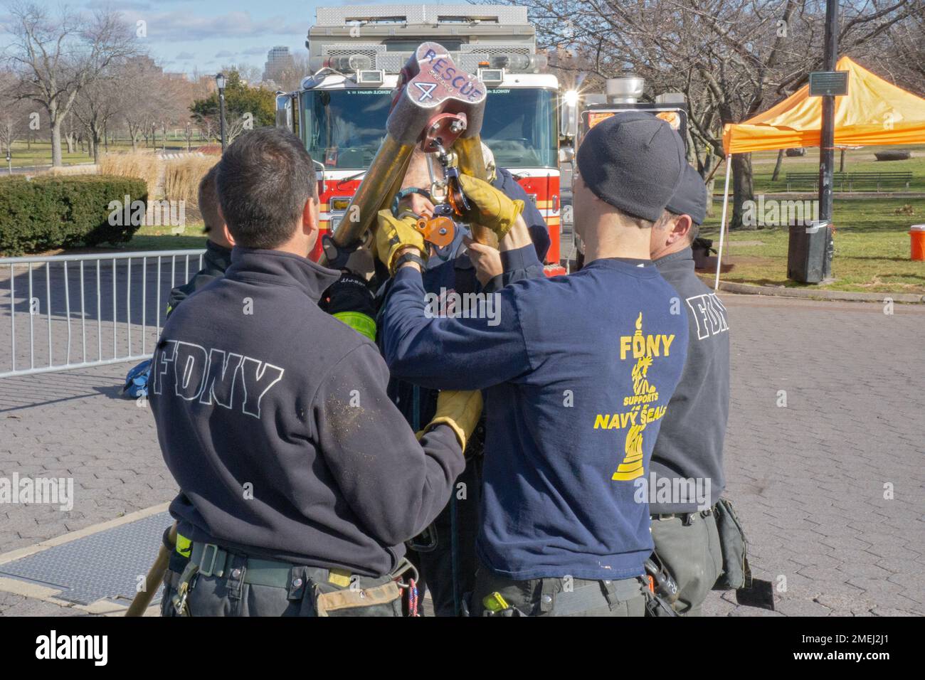 Firemen from various stations train to rescue a person stuck in a hole ...