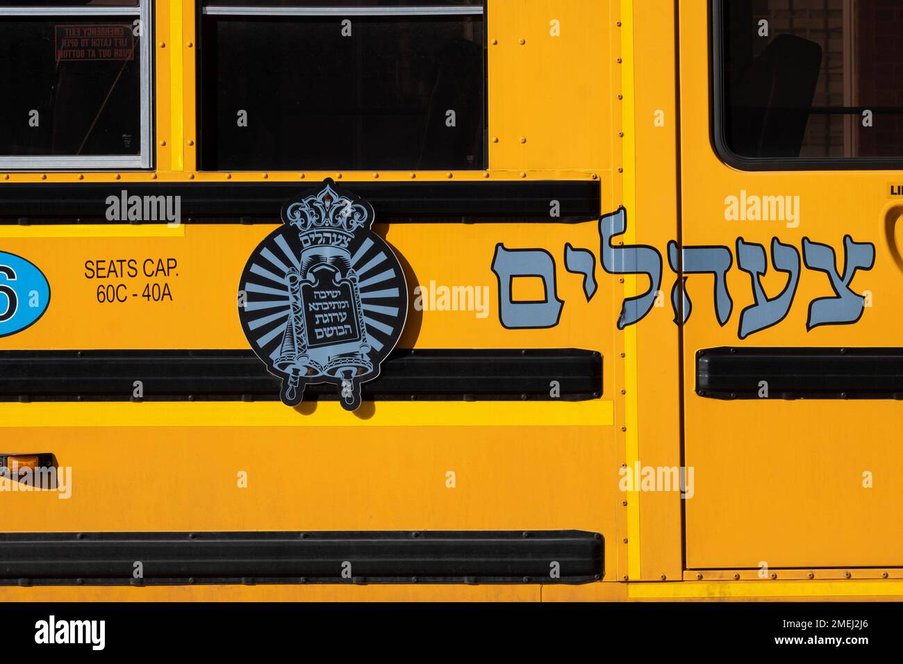 A school bus with a logo of the Tzehelm Hasidic group. Parked in ...