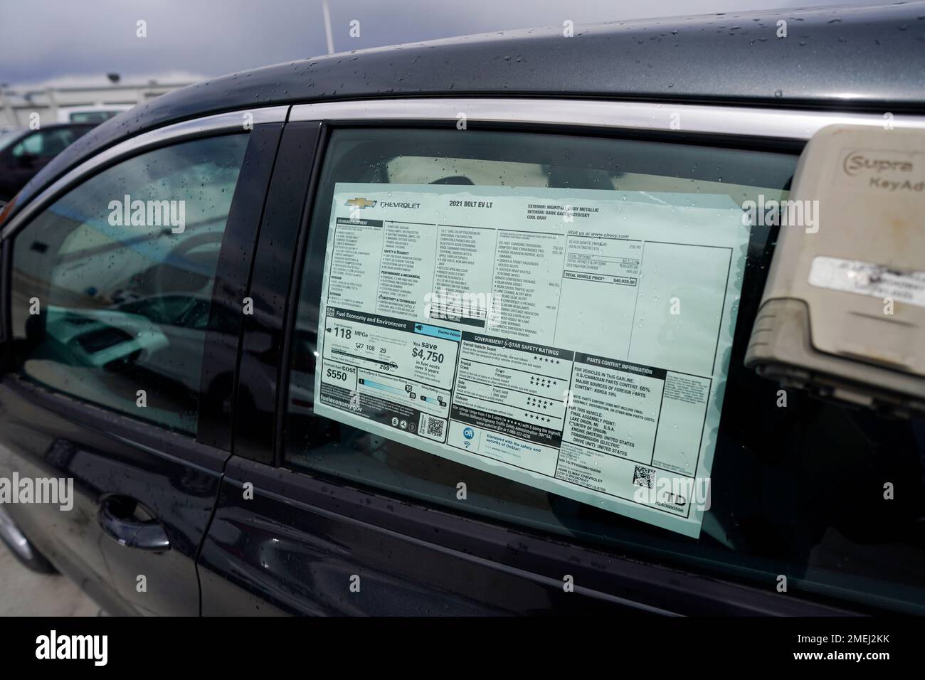 The Maroney label sits in the back side window of an unsold 2021 Bolt ...