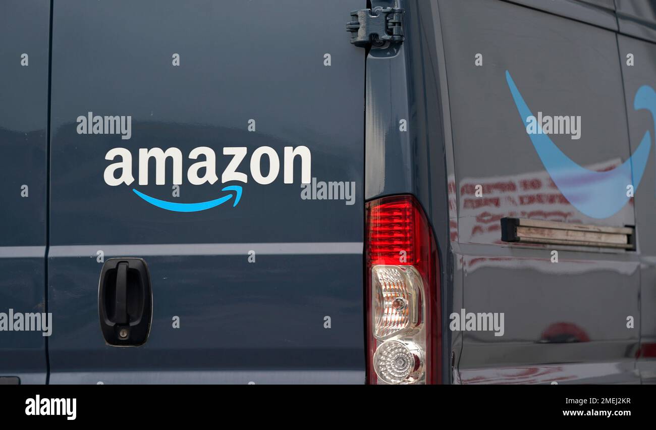 A Ram van used by Amazon sits at a Dodge dealership in this photograph ...