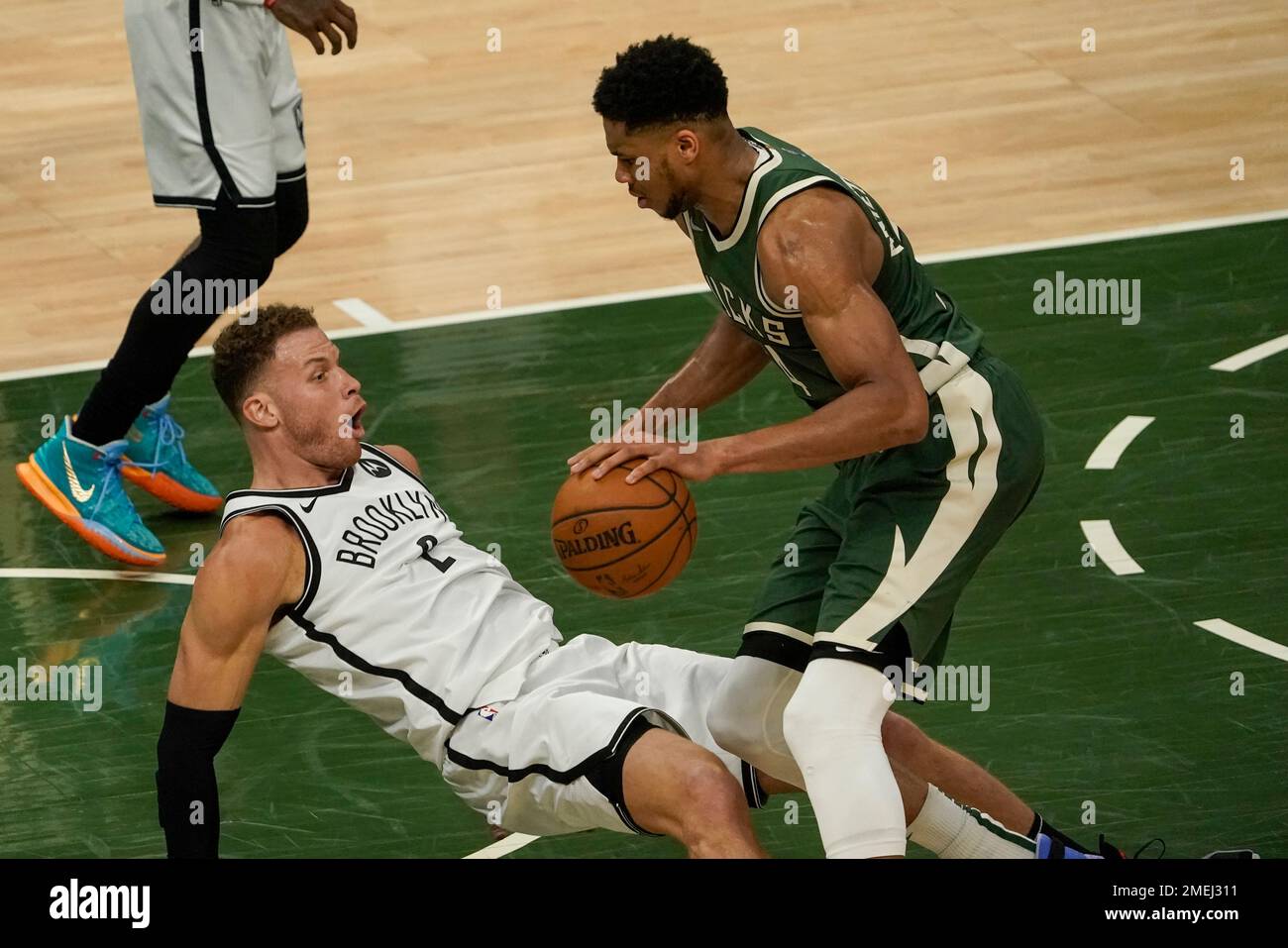 Brooklyn Nets' Blake Griffin draws a charge on Milwaukee Bucks' Giannis ...