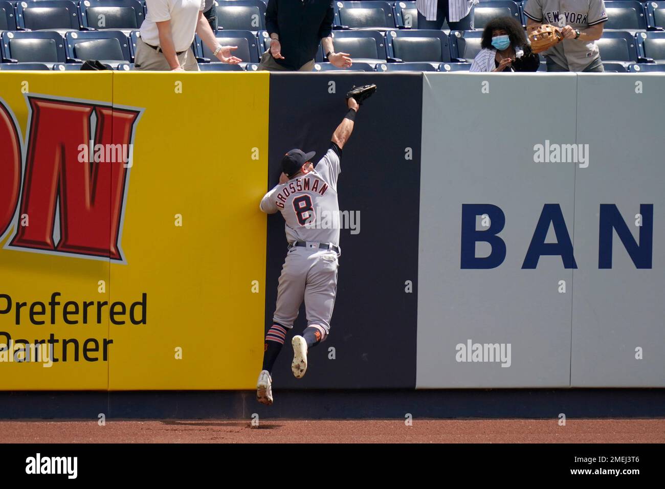 Detroit Tigers right fielder Robbie Grossman grabs a sacrifice fly hit ...