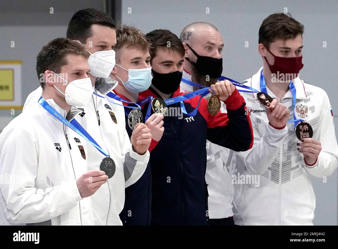 From left; silver medalists Germany's Lars Rudiger and Patrick Hausding, gold medalists Britain ...