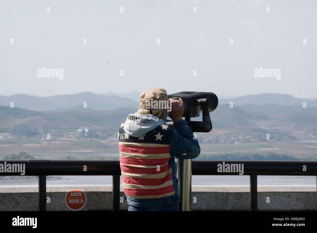 A visitor watches the North Korea side from the Unification Observation ...