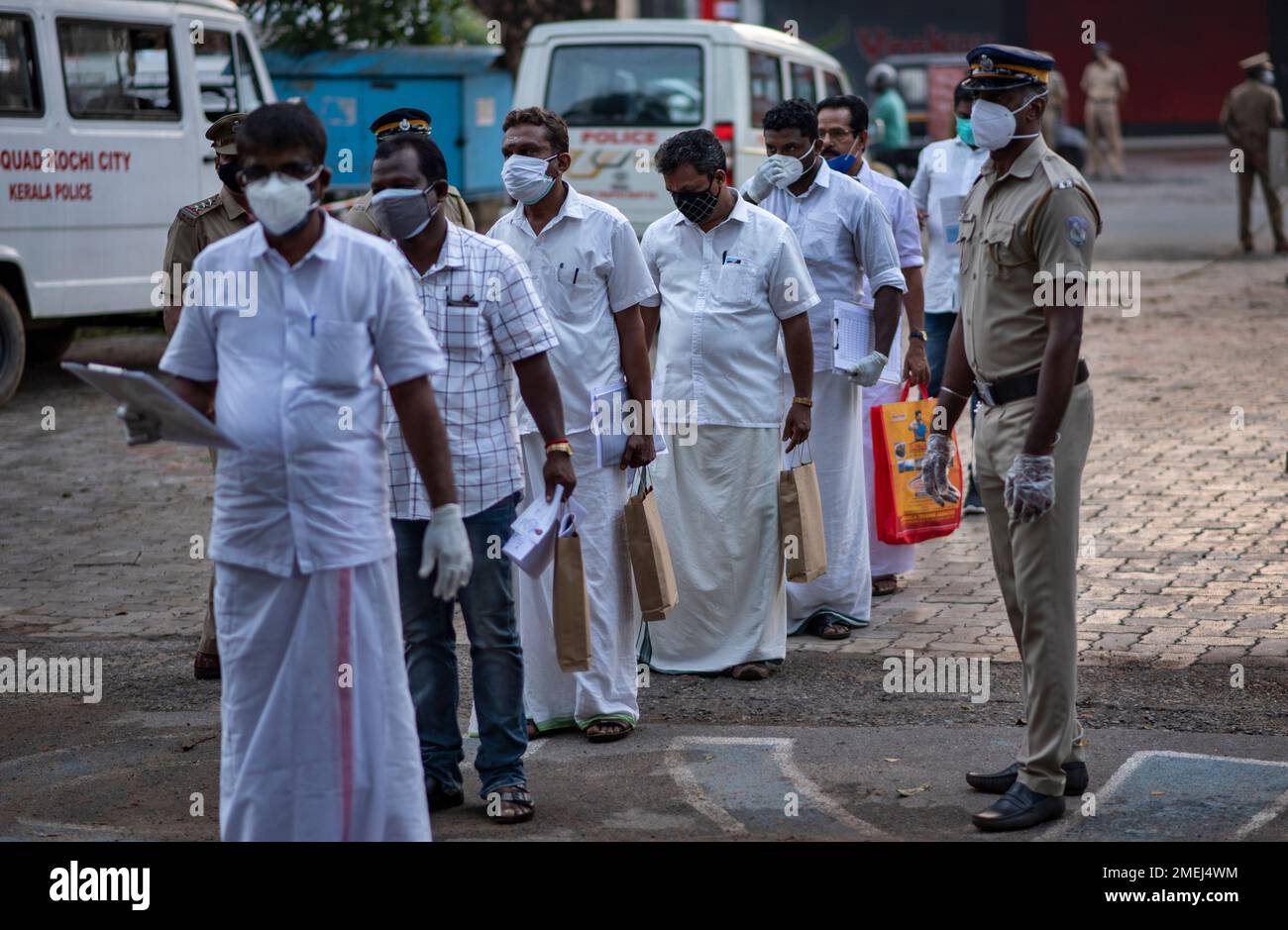 Representatives of candidates wait to enter a vote counting center for ...