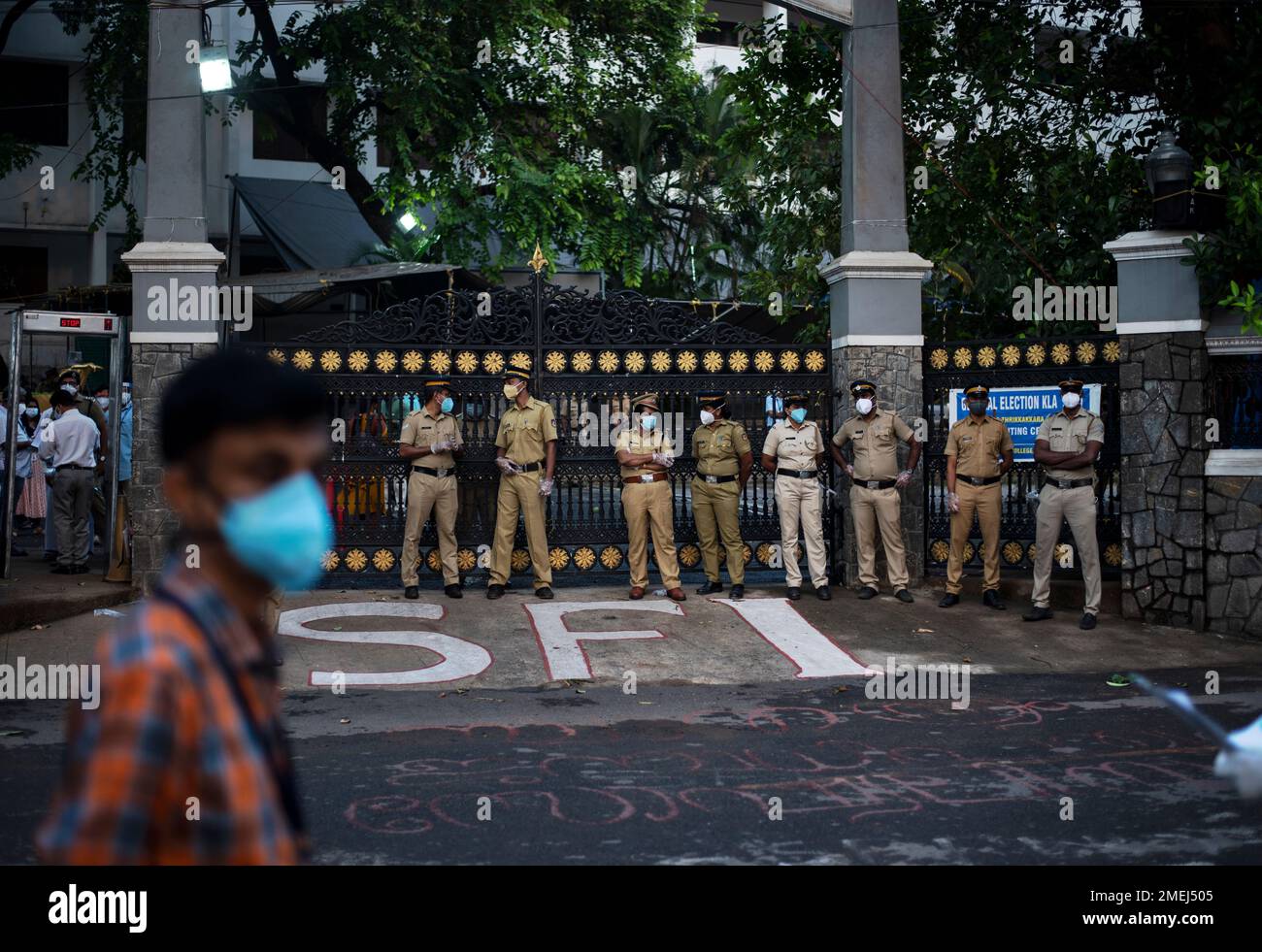 Indian policemen guard outside a vote counting center for the state ...