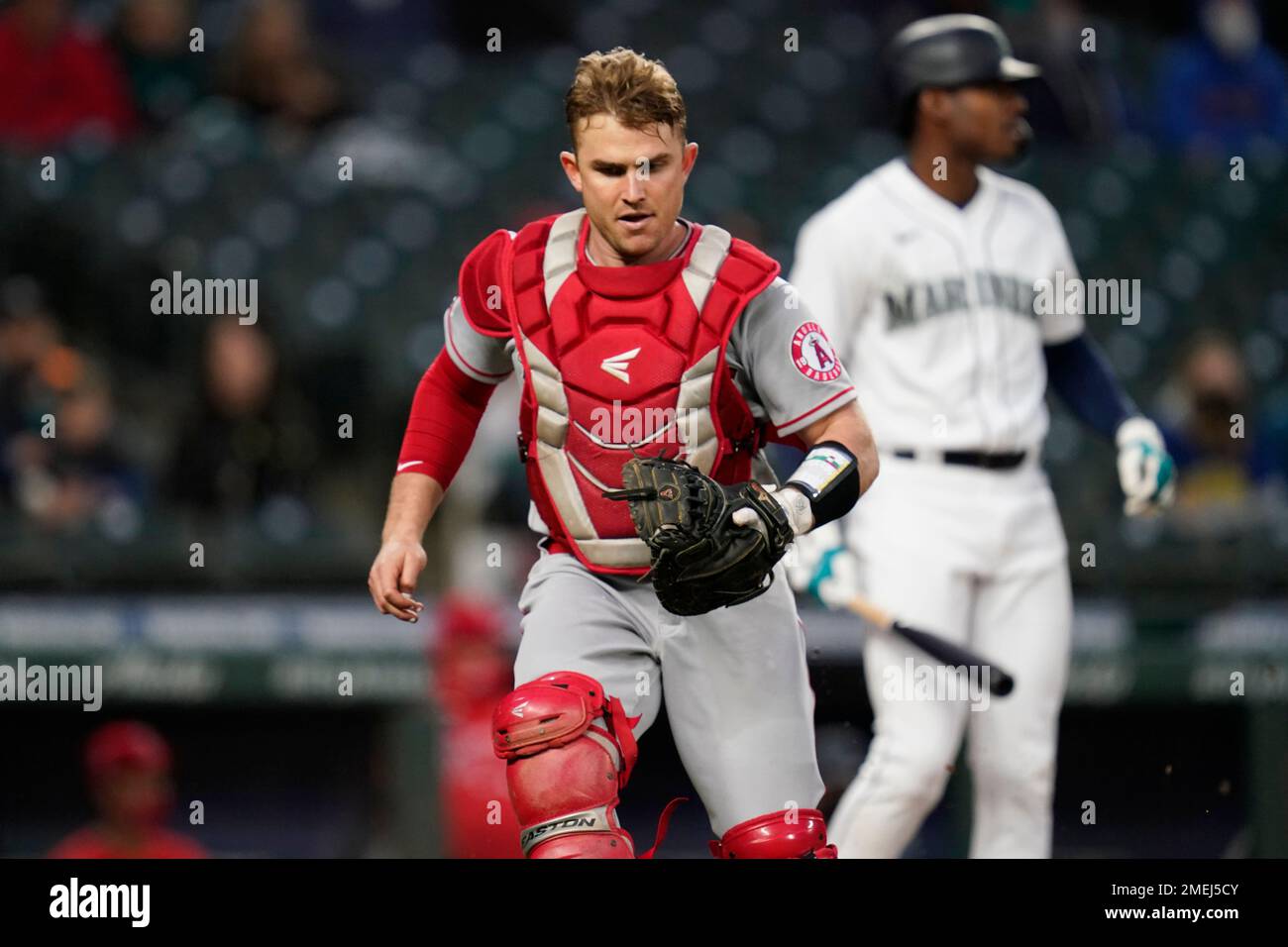 Los Angeles Angels catcher Max Stassi gives chase to a ball against the ...