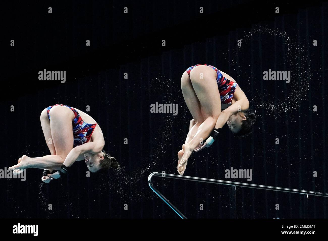 Britain's Eden Cheng and Lois Toulson perform a dive during the women's synchronized 10-meter ...