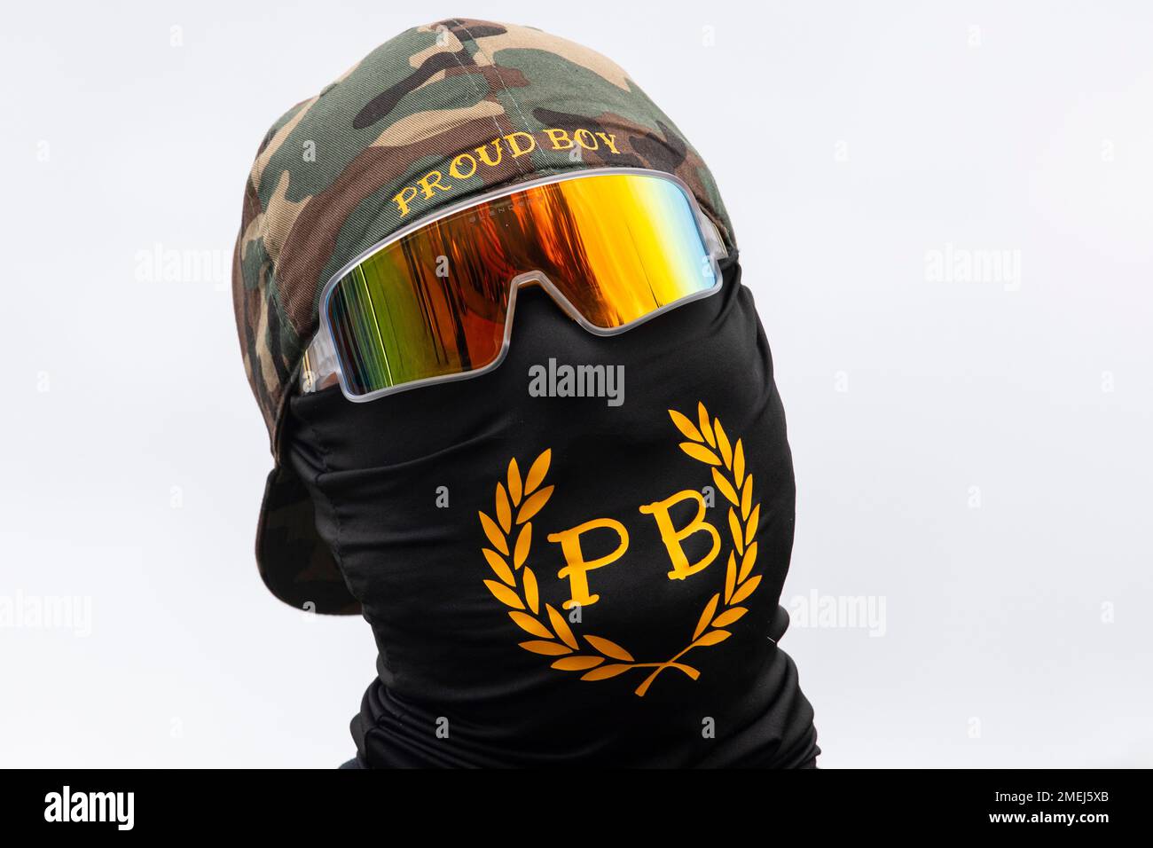 A Proud Boy supporter listens to speeches as a few hundred people ...