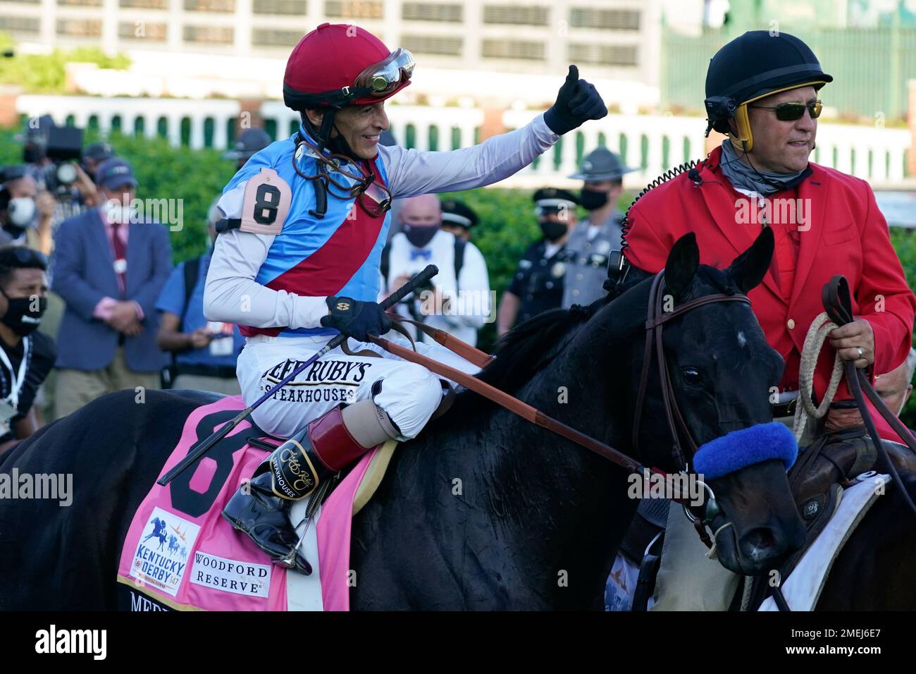 Jockey John Velazquez onboard Medina Spirit gives a thumbs up after ...