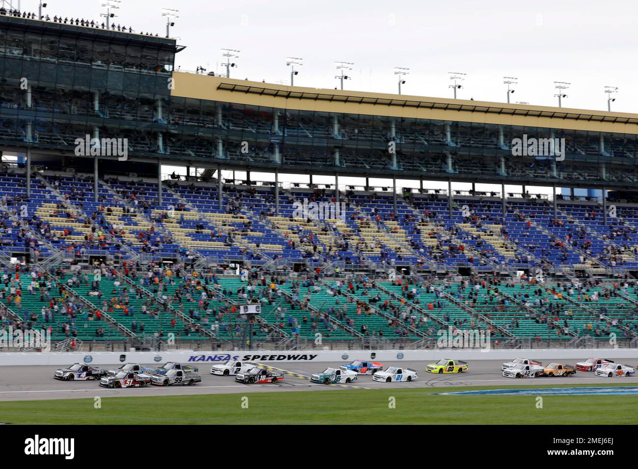Drivers head to turn one at the start of a NASCAR Truck Series auto ...