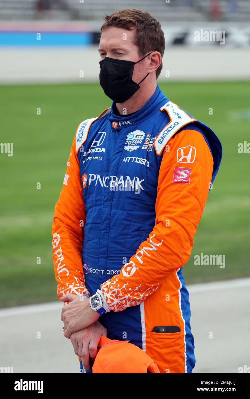 Scott Dixon stands on the grid before the IndyCar Series auto race at ...