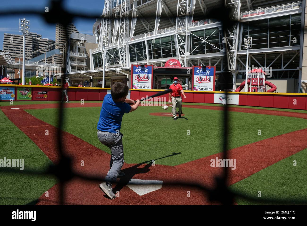 Sam Gartside, 9, hits a Wiffle ball at the Reds Fan Zone Field prior to ...