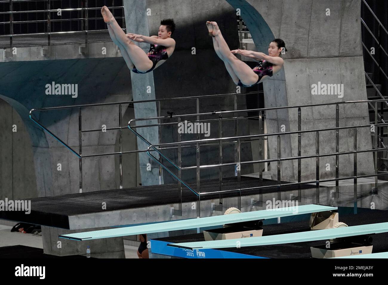 Chang Yani and Chen Yiwen of China dive during the women's synchronized ...