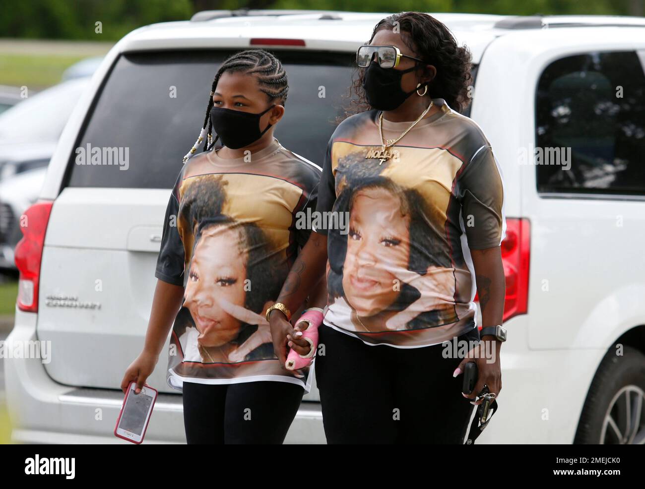 Mourners are seen wearing shirts with Ma'Khia Bryant's picture as they ...
