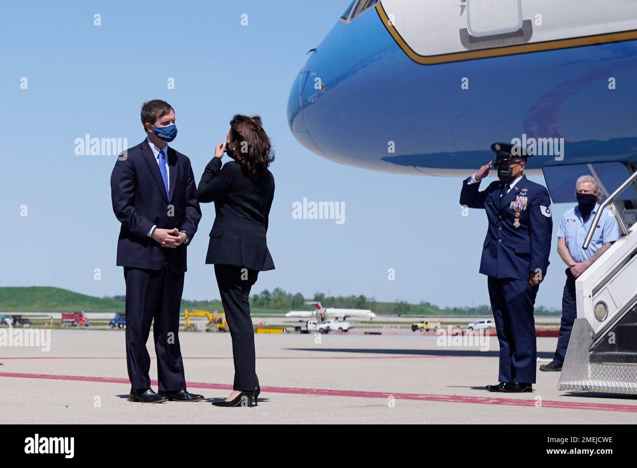 Vice President Kamala Harris talks with Kentucky Gov. Andy Beshear, as ...