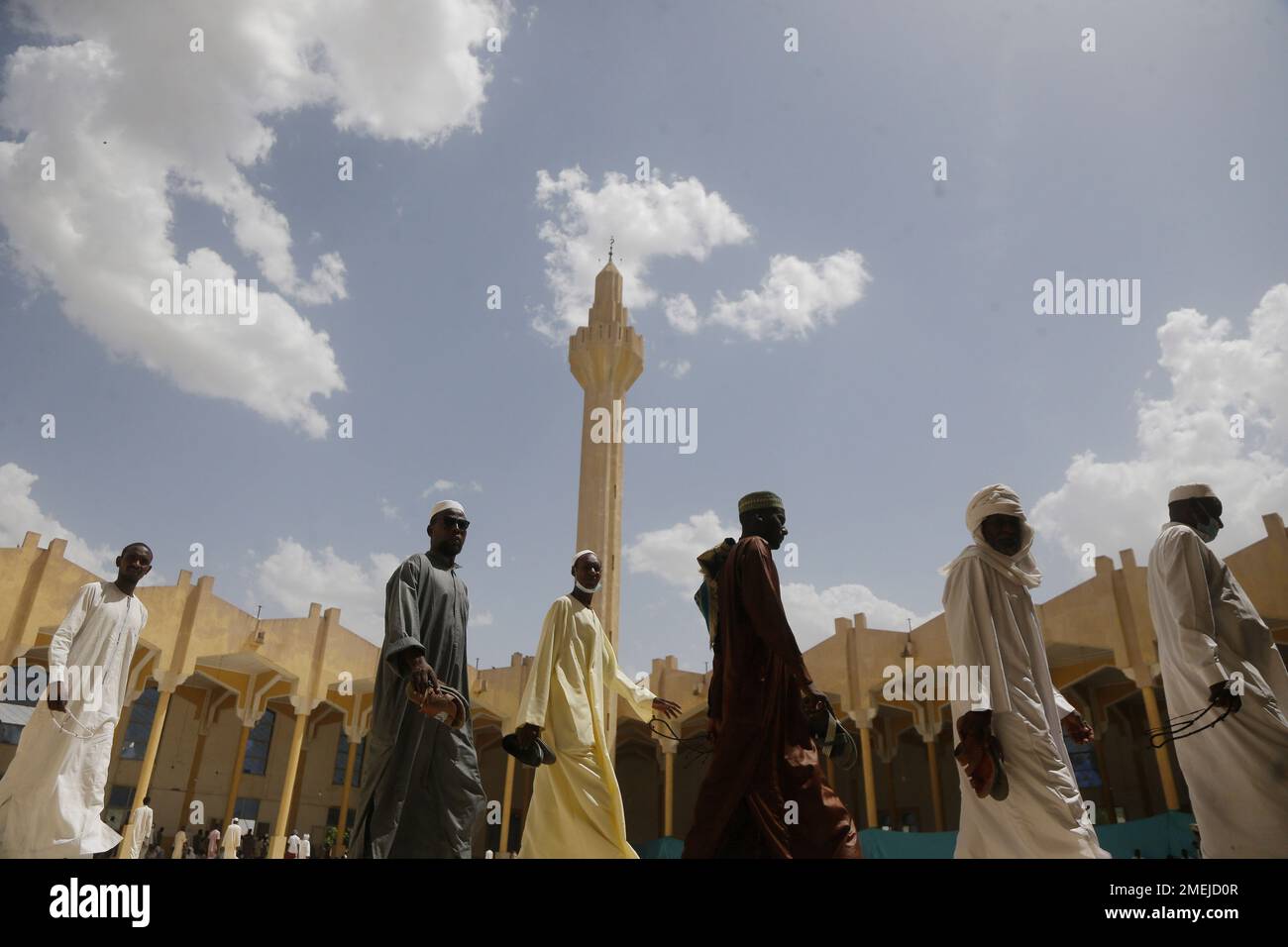 Muslims men leave after Friday prayers during the holy fasting month of ...