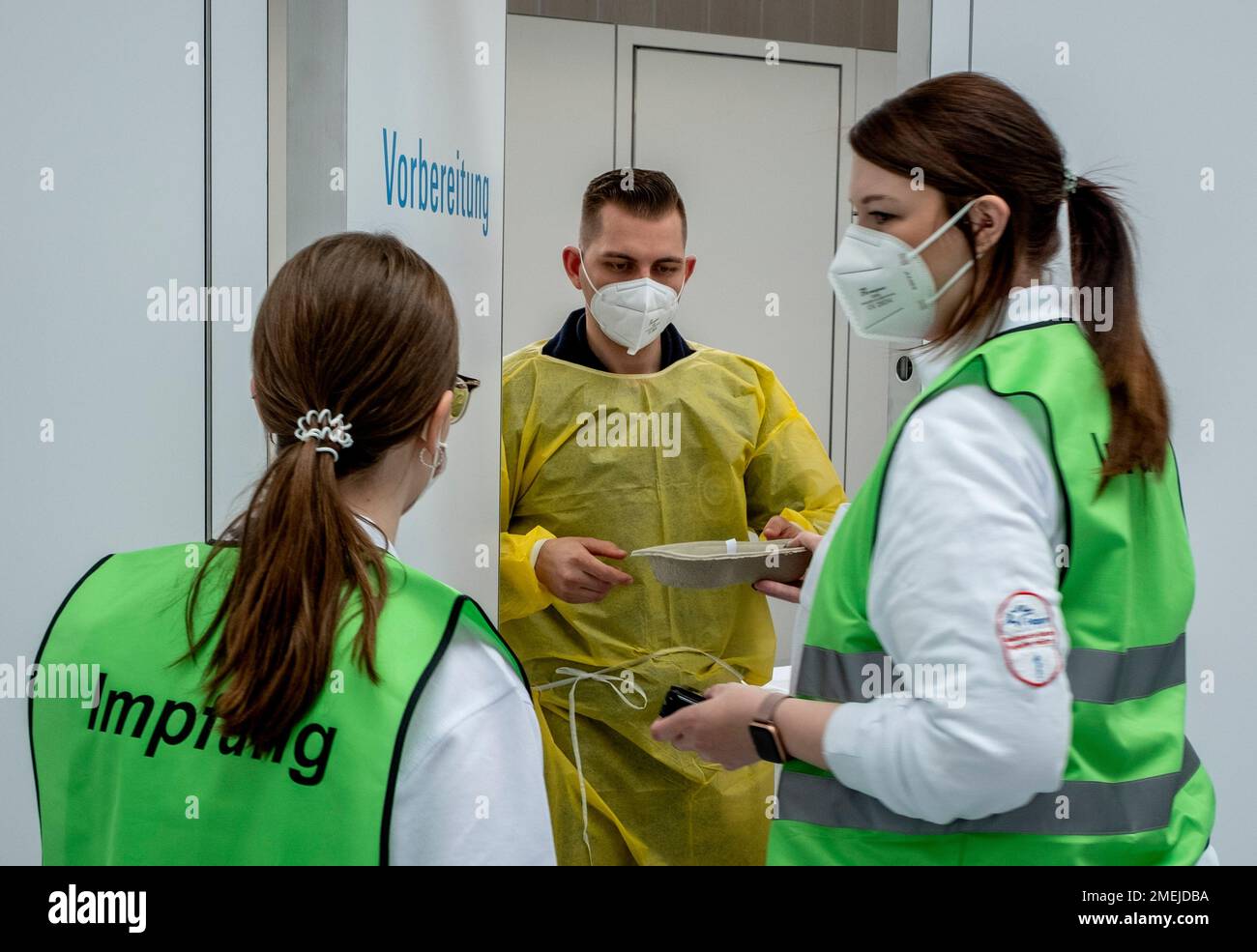A laboratory worker talks to a vaccination doctors as Fraport airport ...