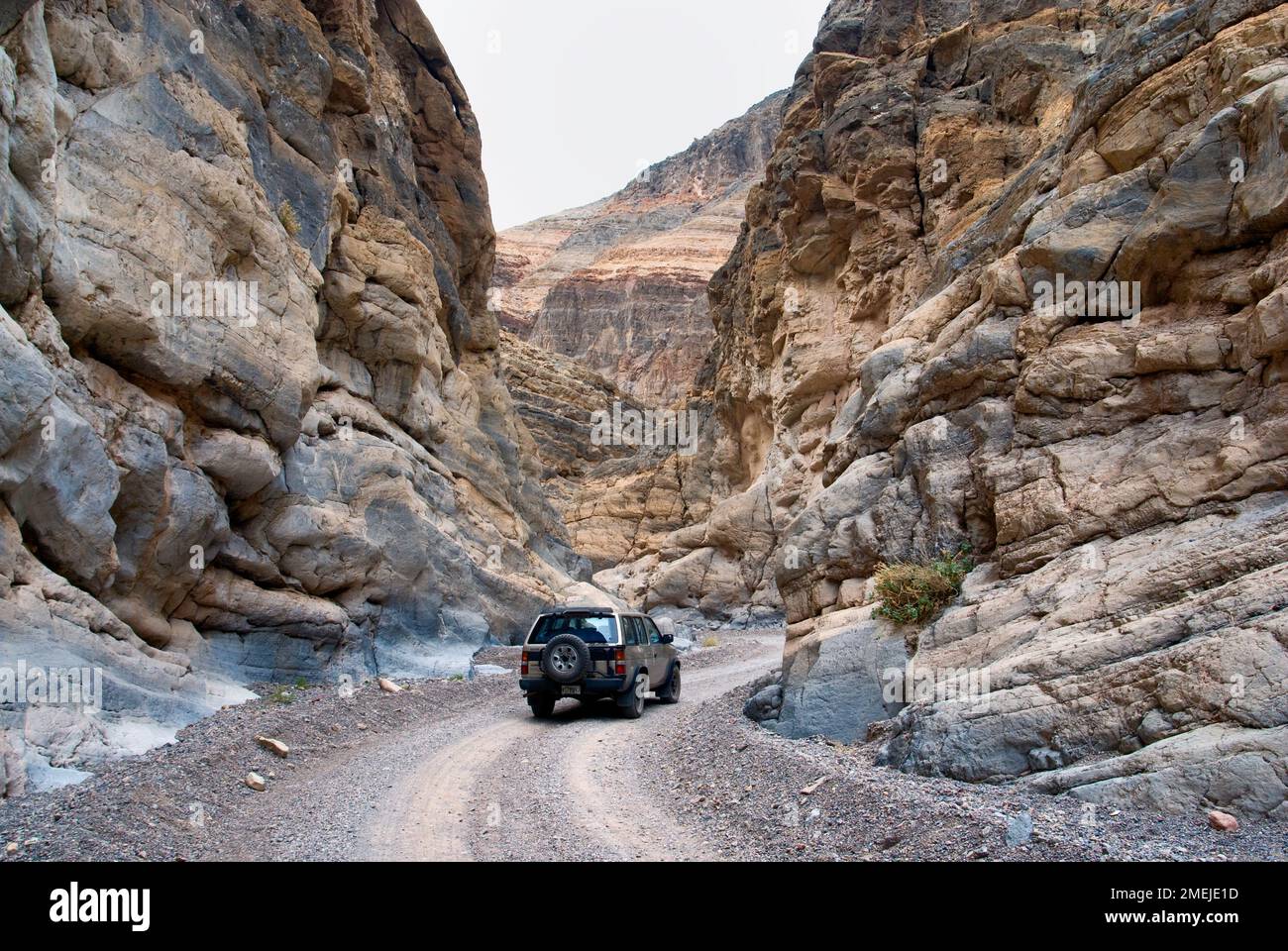 Car at Titus Canyon, slot canyon in Grapevine Mountains, Death Valley ...