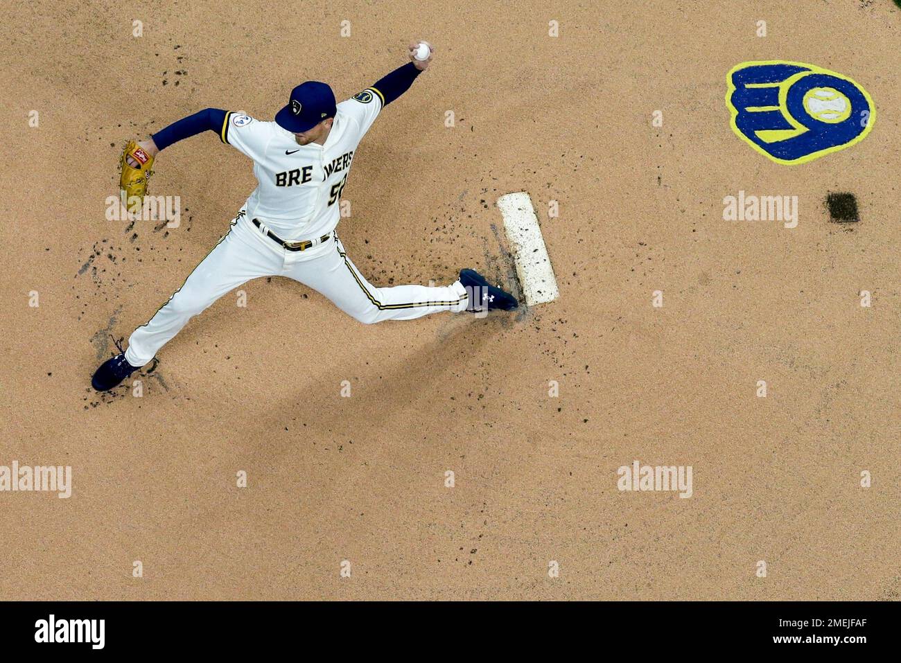 Milwaukee Brewers starter Eric Lauer throws during the first inning of ...
