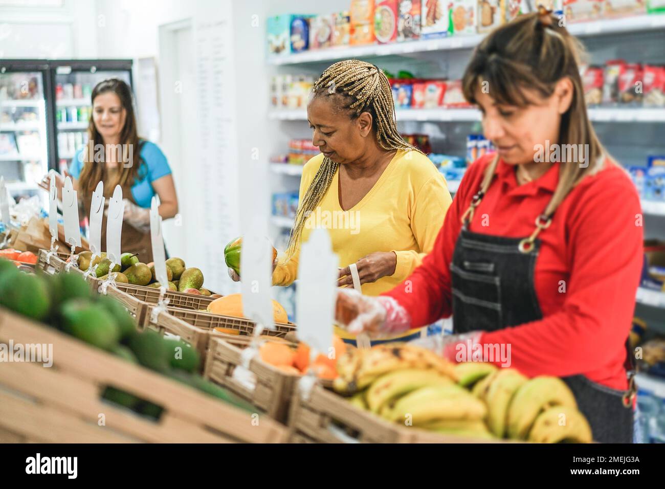 Female customer buying organic food fruits inside eco fresh market ...
