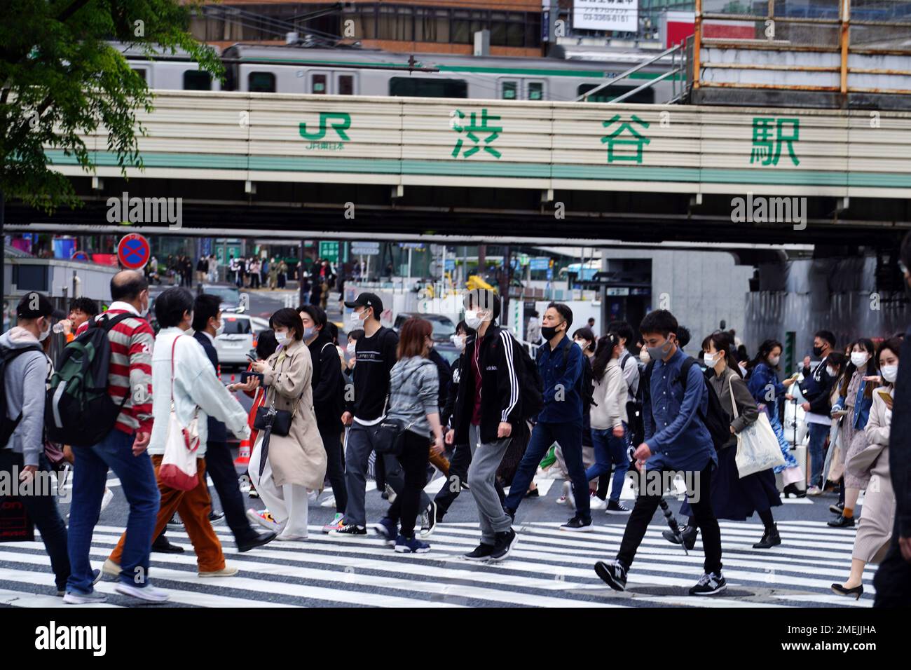 People wearing protective masks to help curb the spread of the ...