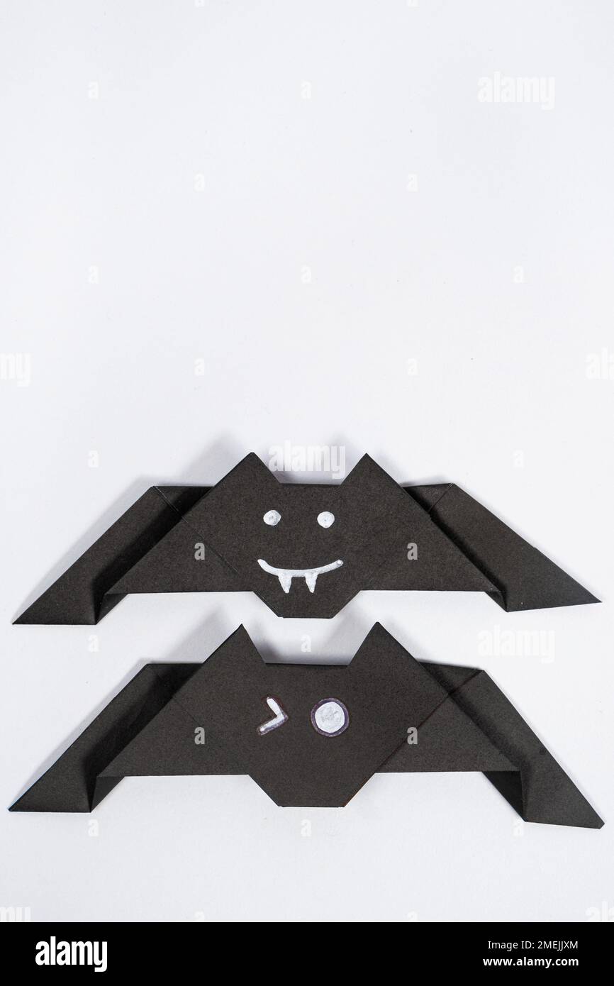 Halloween bats, origami DIY paper crafts on white background, top view ...